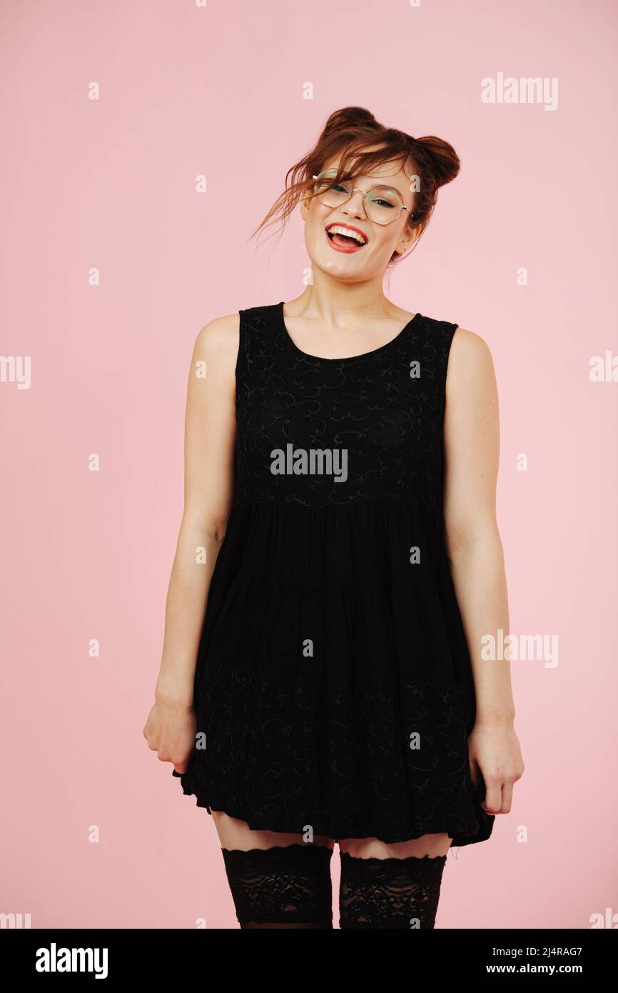 Childish eccentric lady in adult outfit, wearing black mini dress and ...