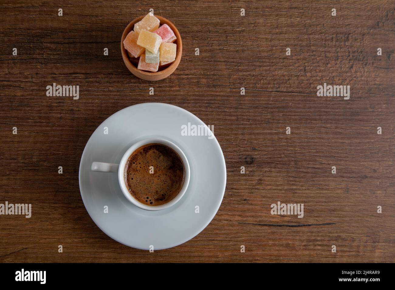 Traditional Turkish delight and Turkish coffee on a wooden background ...