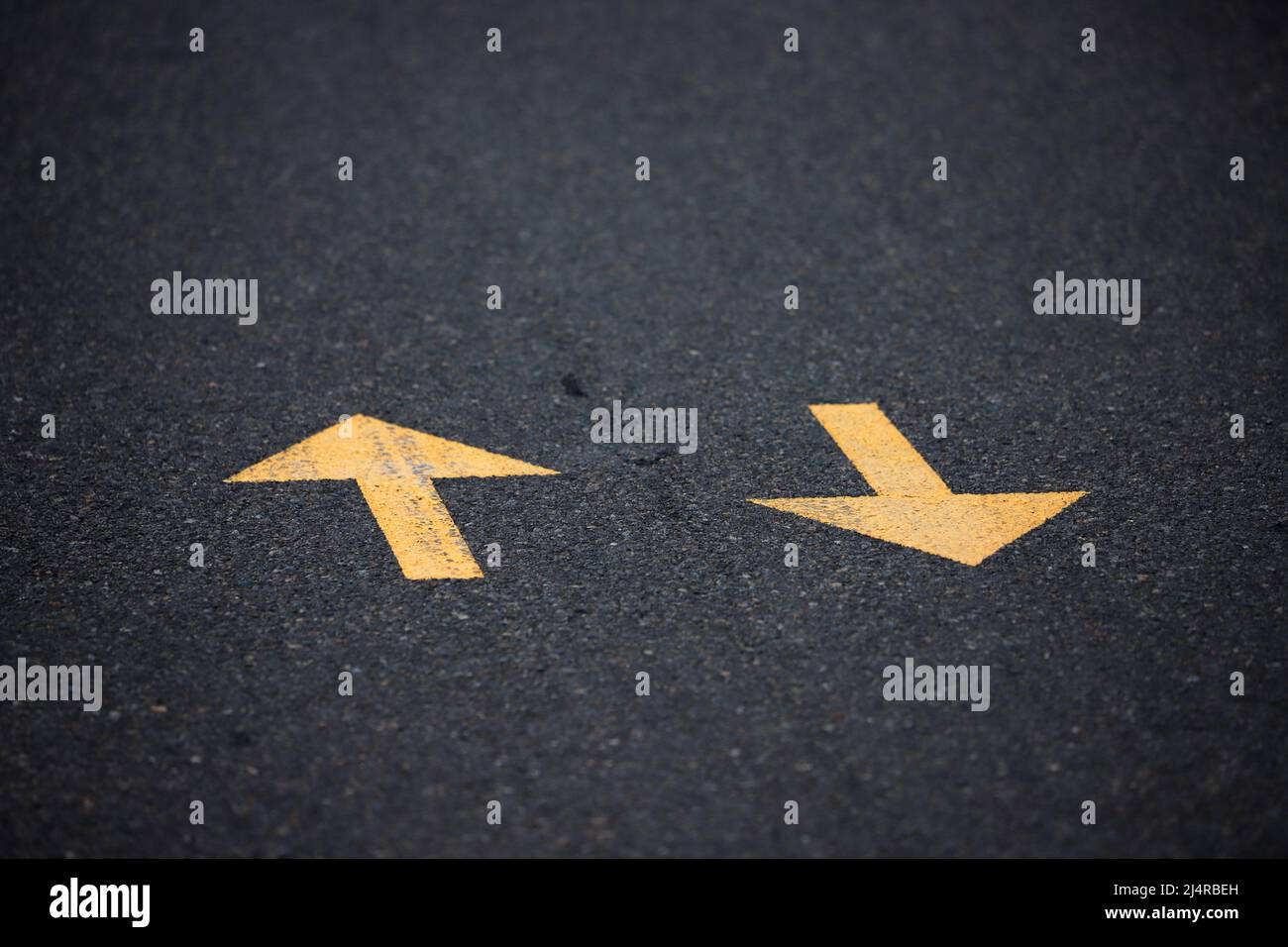 Direction arrows drawn on the road on asphalt Stock Photo - Alamy