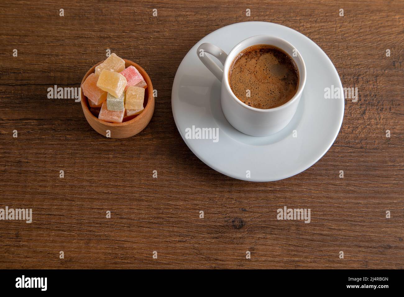 Traditional Turkish delight and Turkish coffee on a wooden background ...