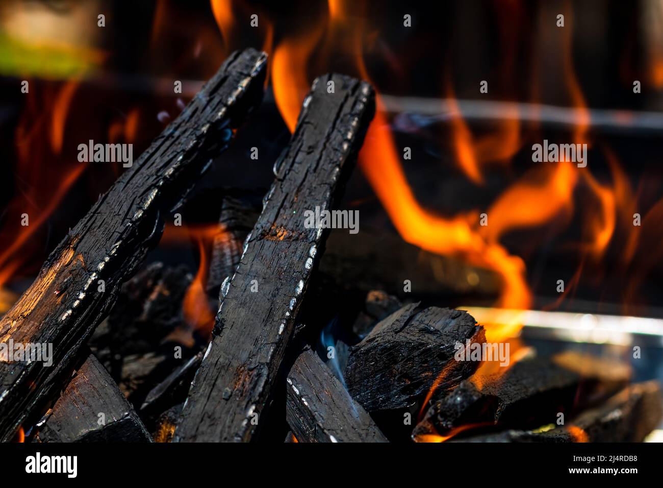 Barbecue grill pit with glowing and flaming hot open fire with red ...