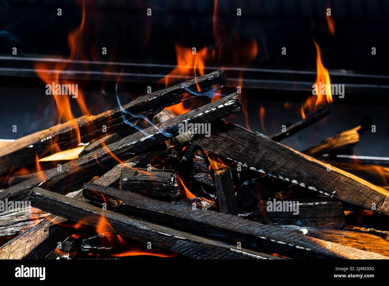 Barbecue grill pit with glowing and flaming hot open fire with red ...