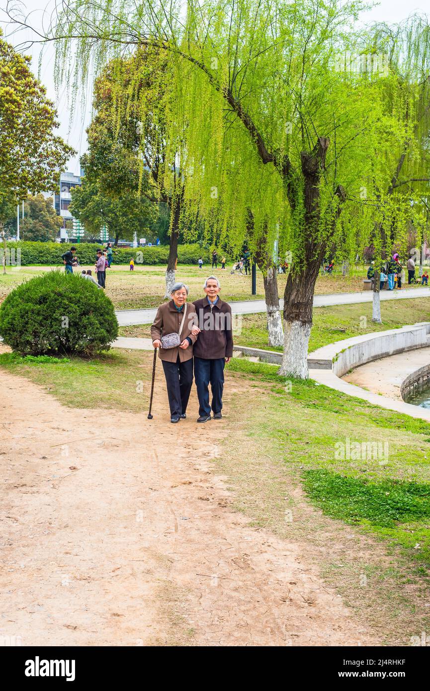 Old chinese man walking stick hi-res stock photography and images - Alamy