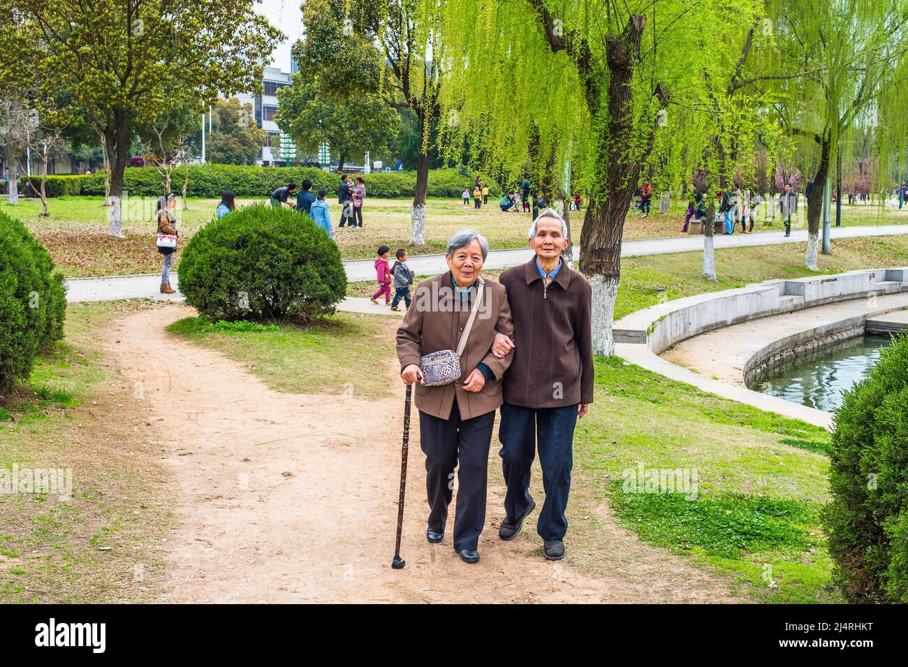 Old chinese man walking stick hi-res stock photography and images - Alamy