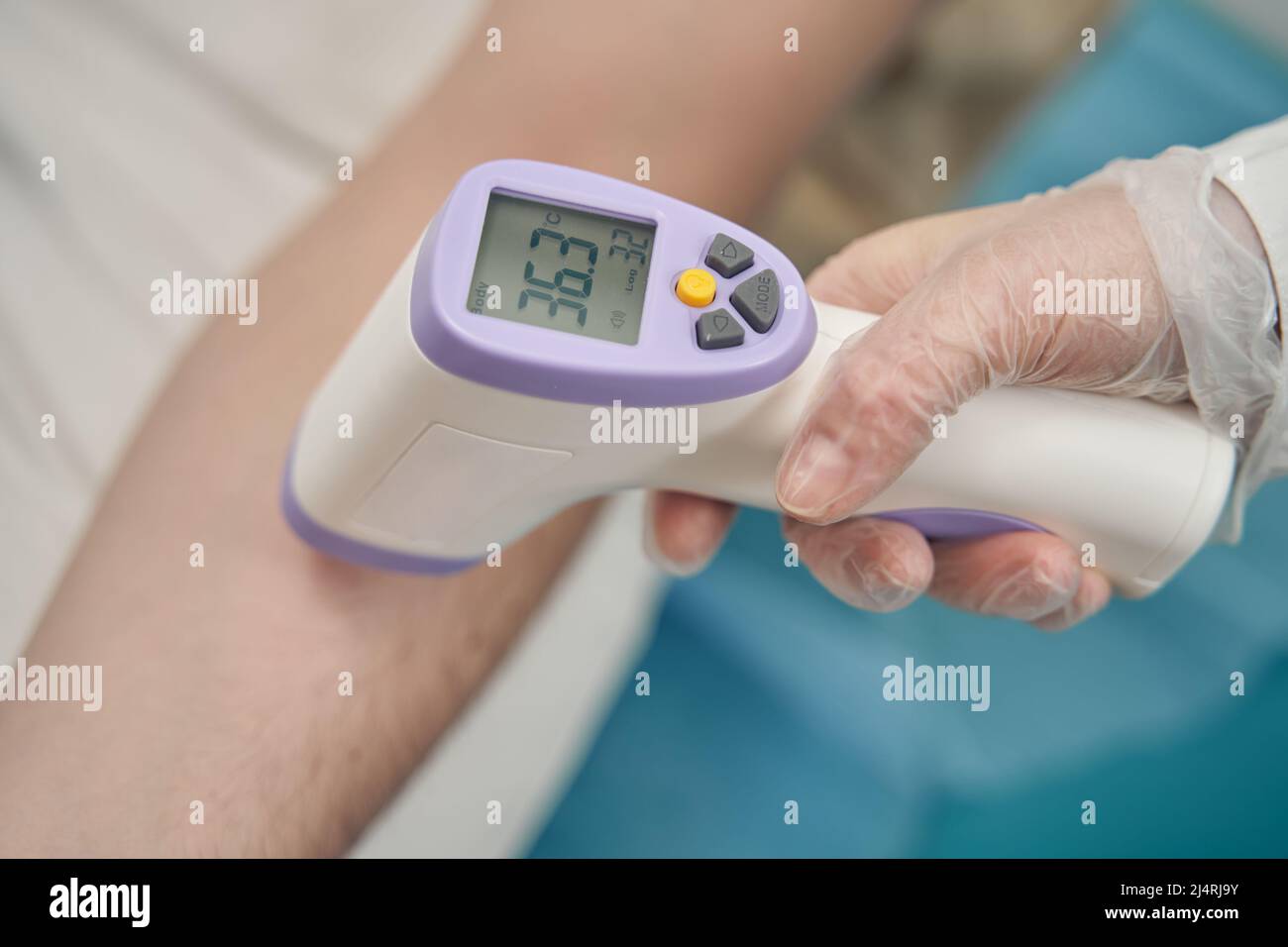 Doctor taking temperature office hi-res stock photography and images ...