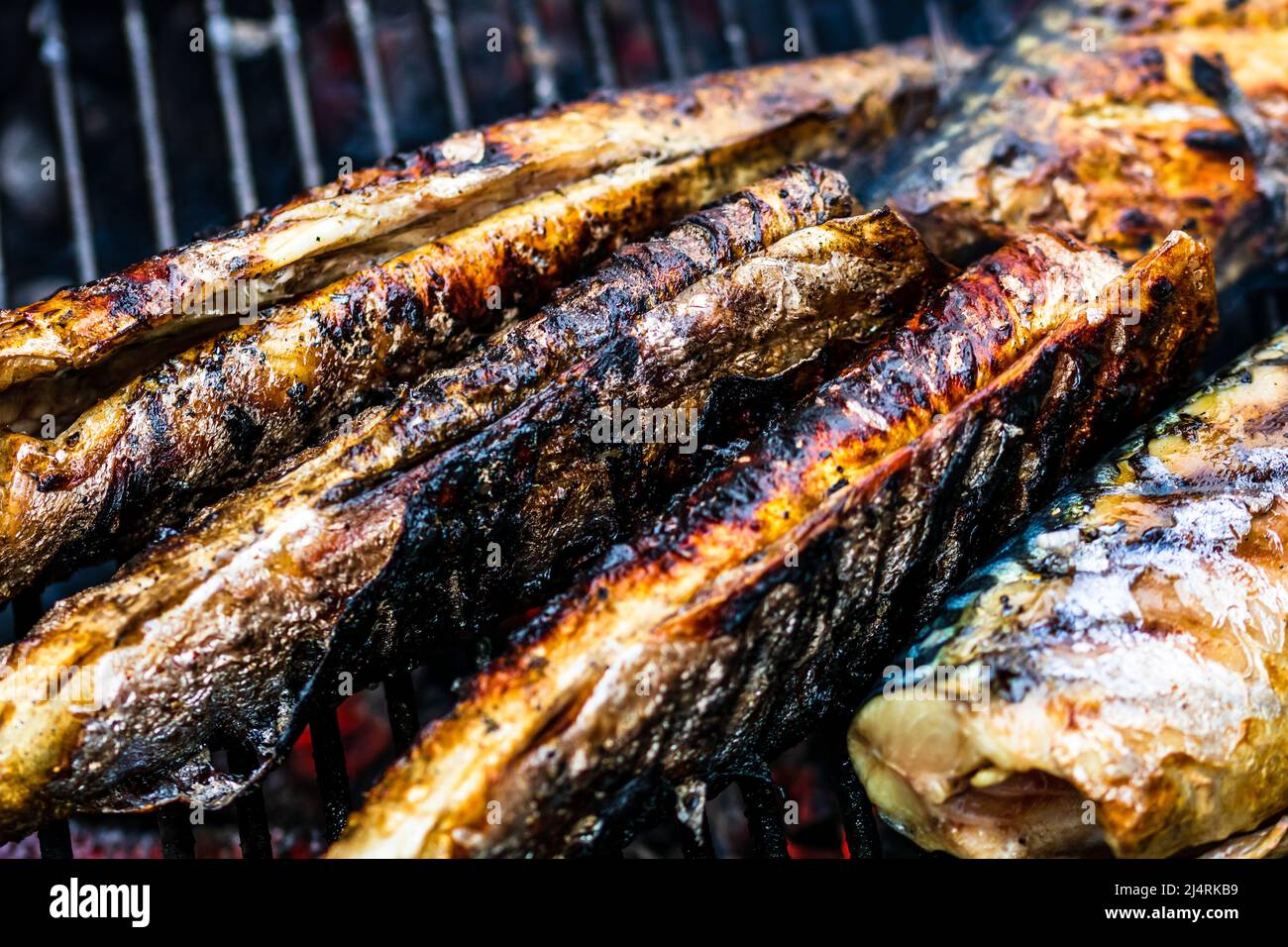 Grilled fish on charcoal grill. Fresh fish barbecue Stock Photo - Alamy