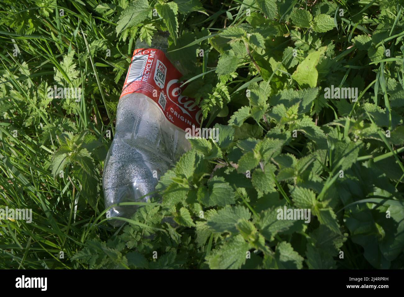 discarded coca cola bottle, england Stock Photo - Alamy