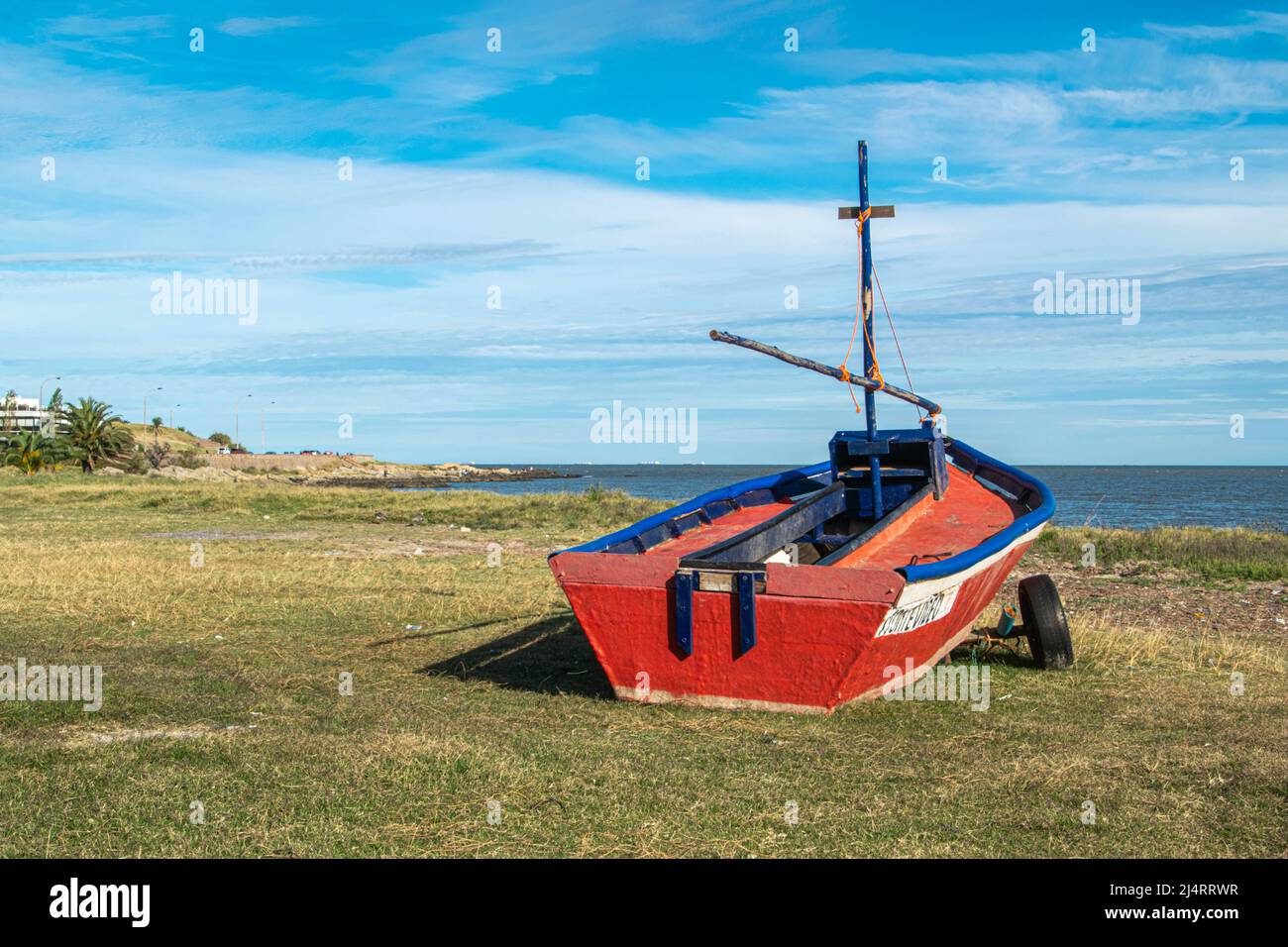 Red fishing boat outside the water in Montevideo Stock Photo - Alamy
