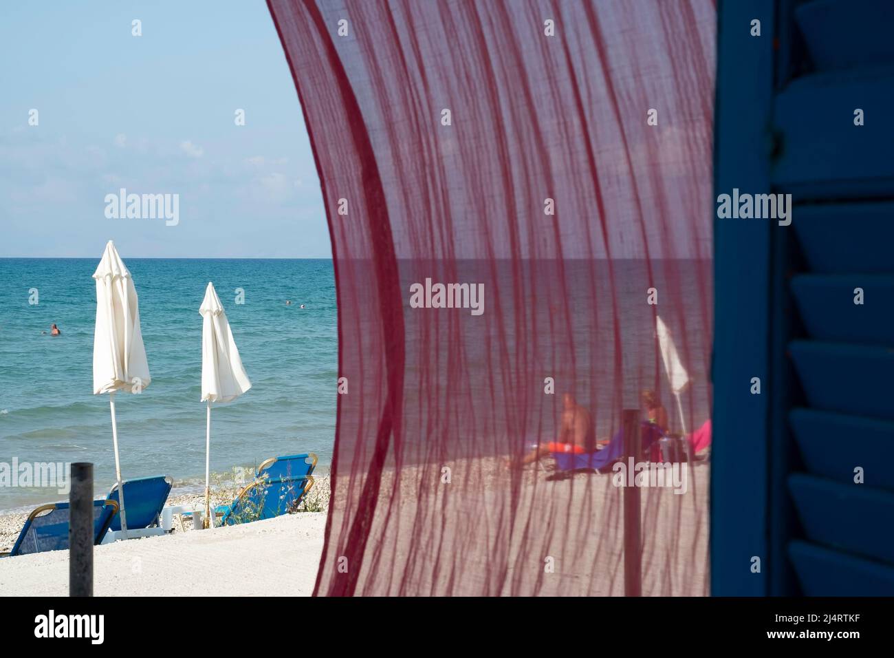 View of beach through the windows Stock Photo - Alamy