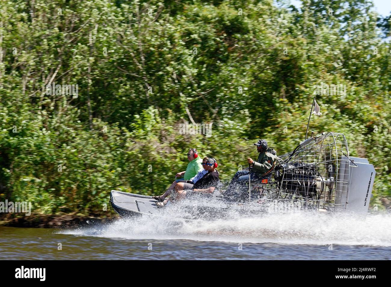 airboat moving fast, people, tour, 2 rows of seats, water spray, noisy ...