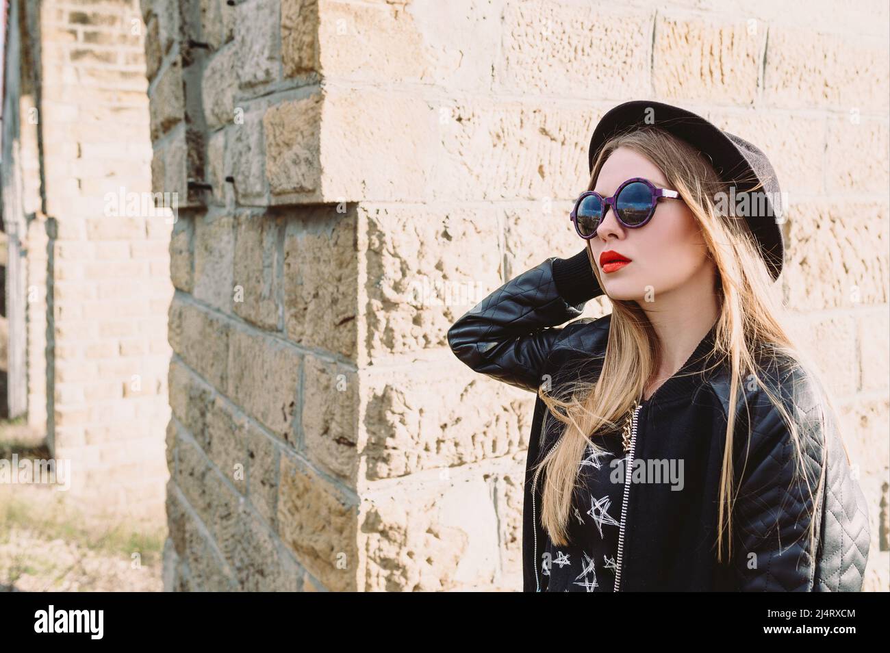 Stylish hipster woman traveler by the old bridge viaduct. Traveling ...