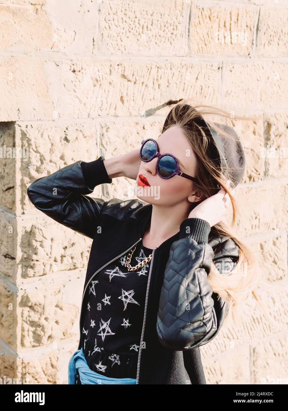 Stylish hipster woman traveler by the old bridge viaduct. Traveling ...