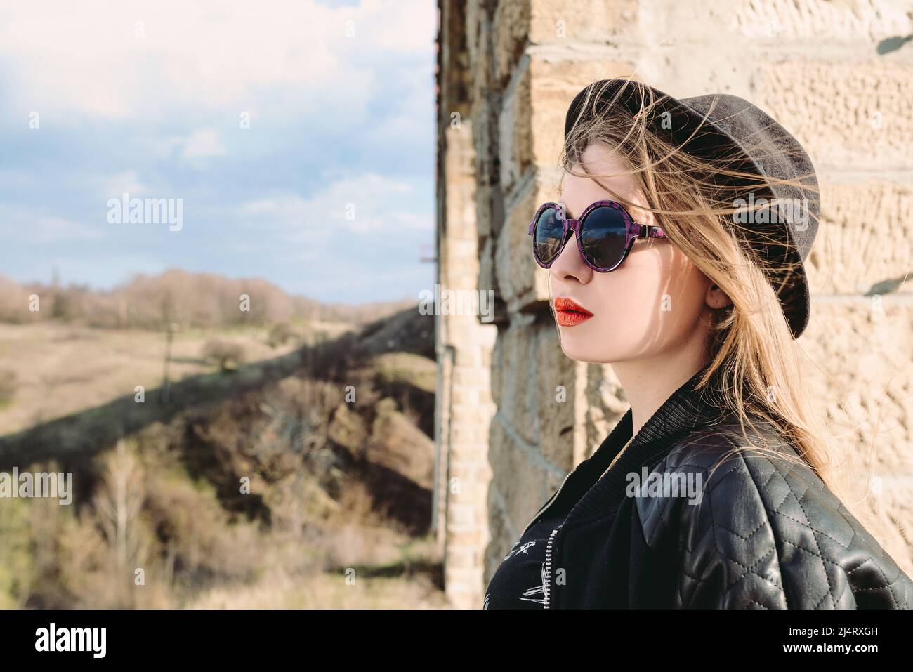 Stylish hipster woman traveler by the old bridge viaduct. Traveling ...