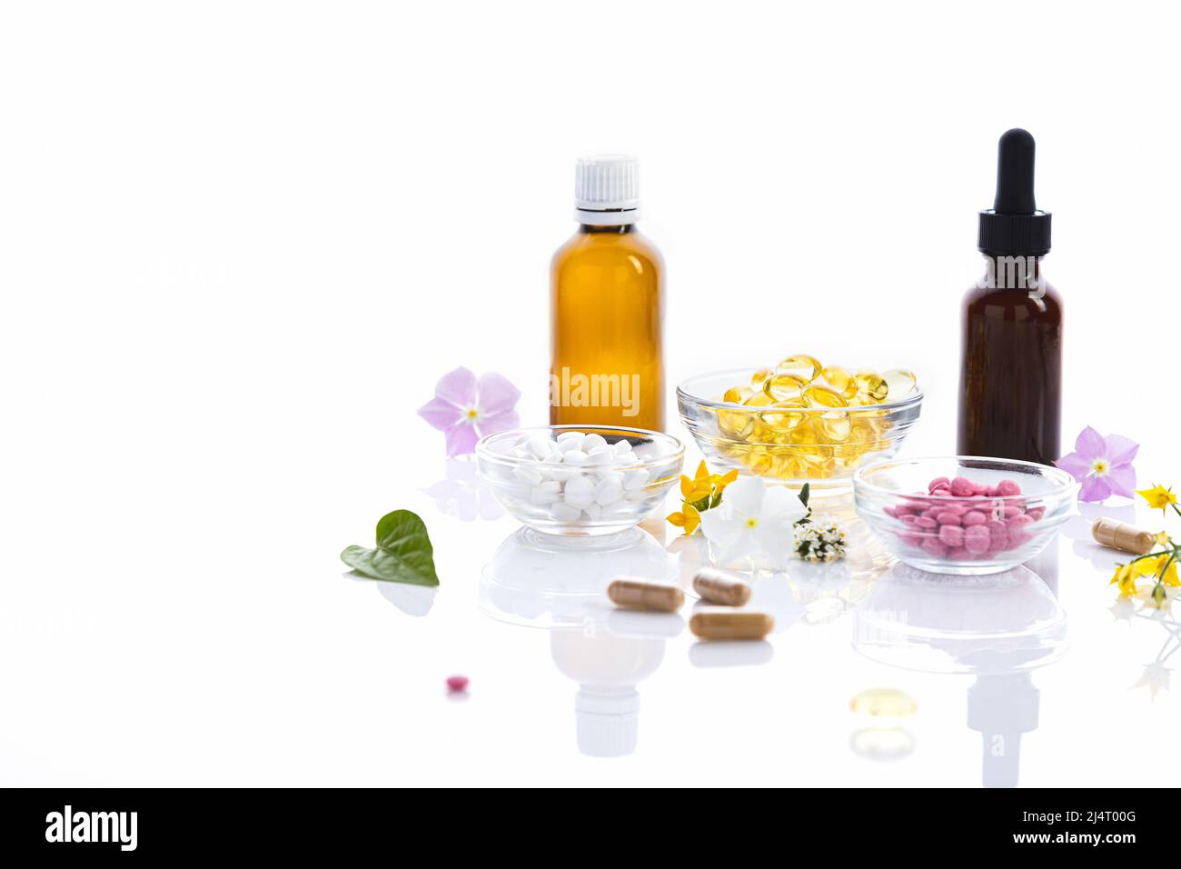 Various vitamin capsules and dietary supplements isolated on white ...