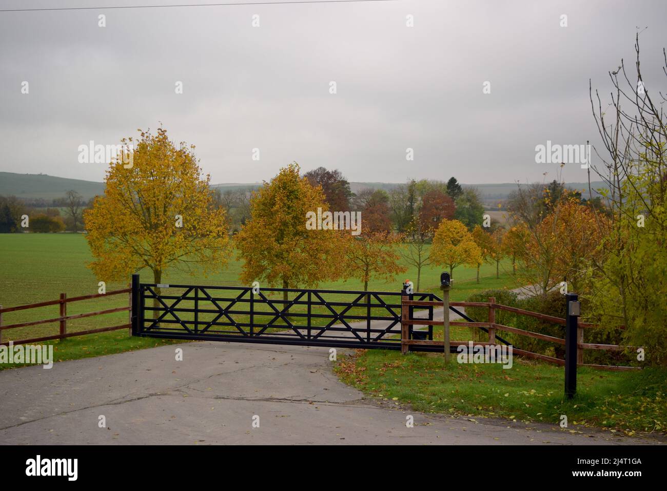 Landscape view with farm gates in Autumn Stock Photo - Alamy