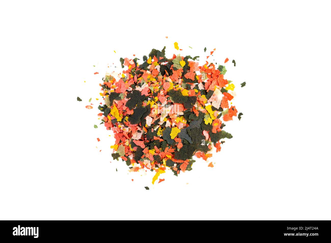 Dry multi-colored compound fish feed flakes in a transparent box on ...