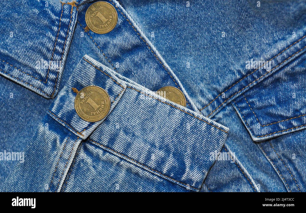 Part of Jeans jacket with gold coin cuffings and buttons Stock Photo ...