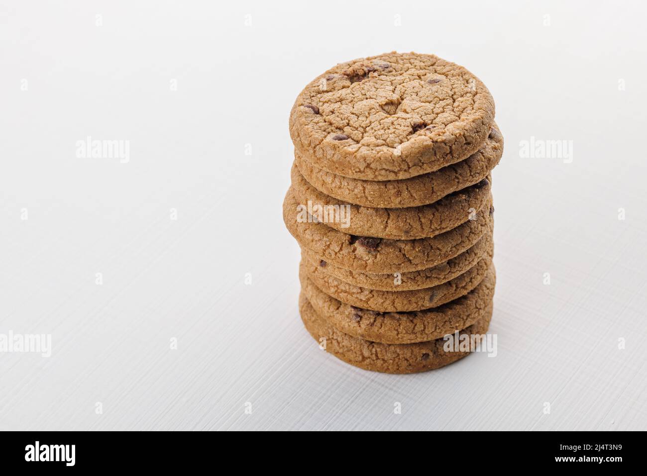vertical stack of round chip cake cookies with chocolate on white ...