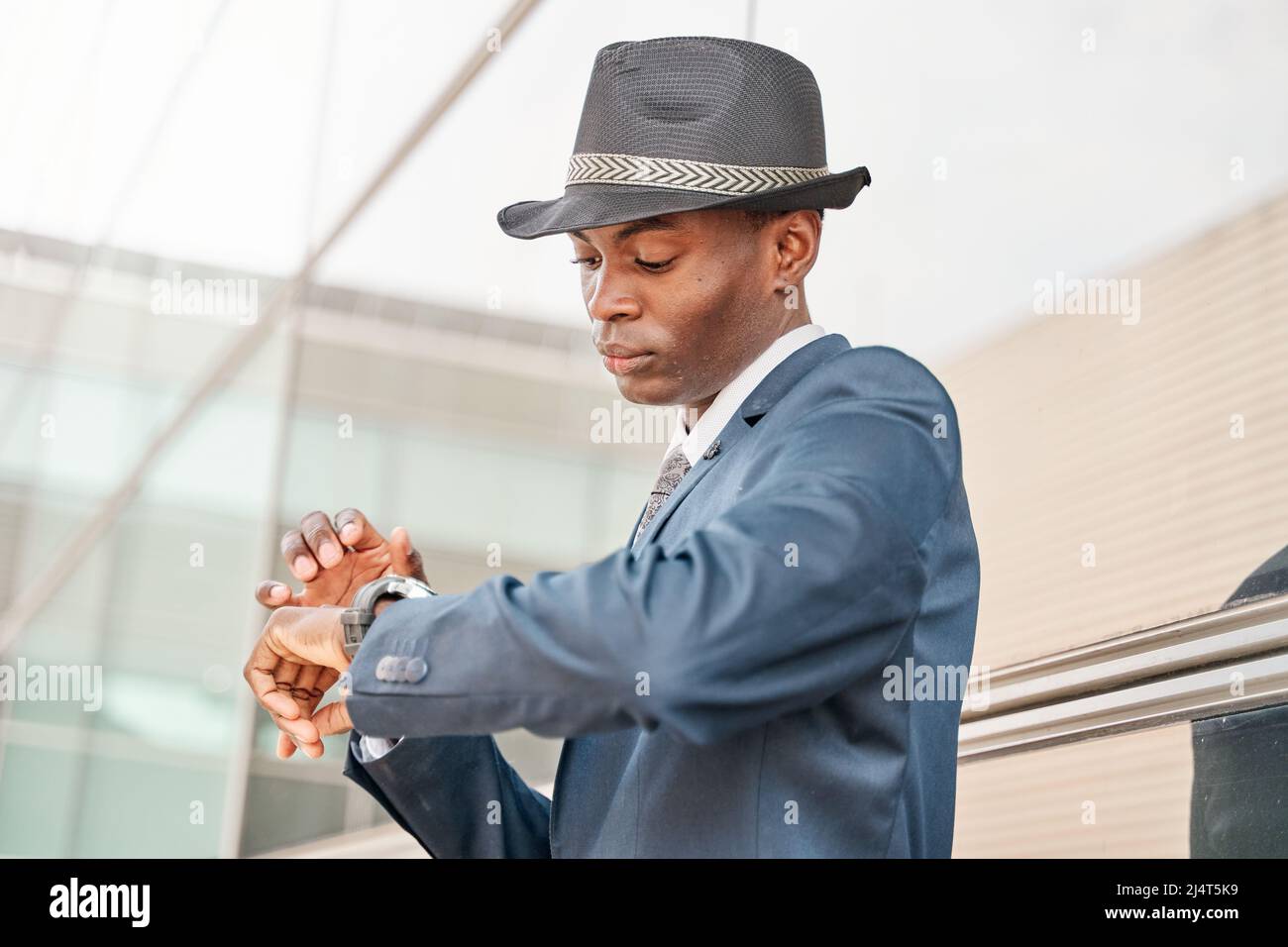 Portrait of serious intelligent handsome African wearing stylish hat ...