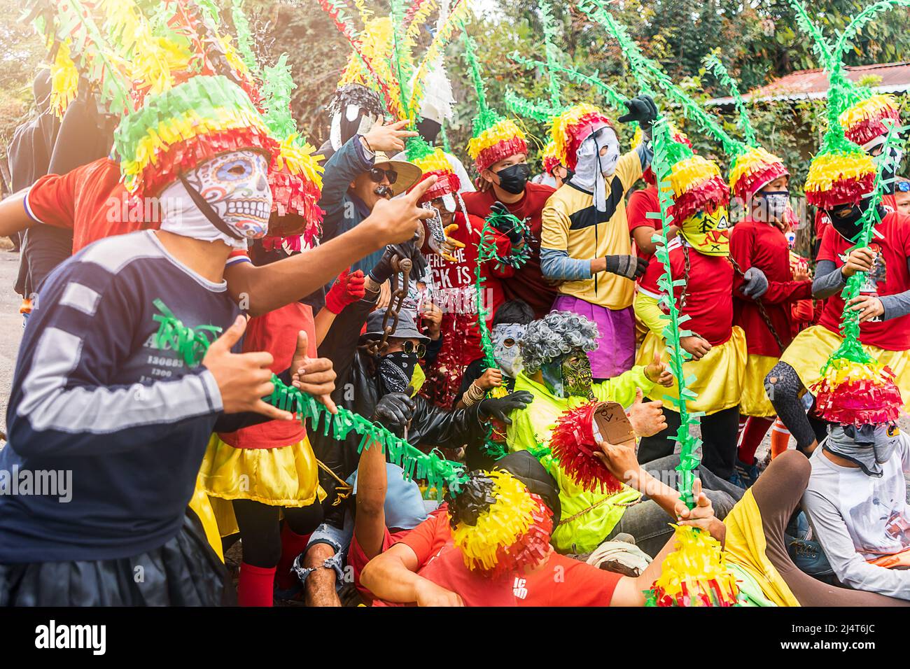 Group of Latino youth dressed in traditional Holy Week costumes pose ...