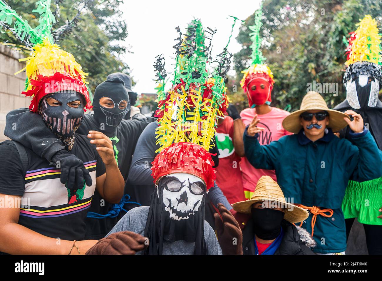 Group of Latino youth dressed in traditional Holy Week costumes looking ...