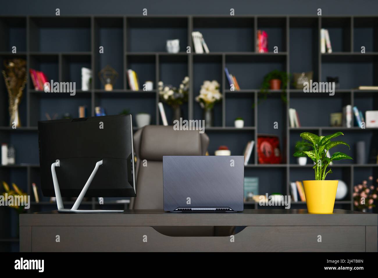 Table with laptop in home office interior Stock Photo - Alamy