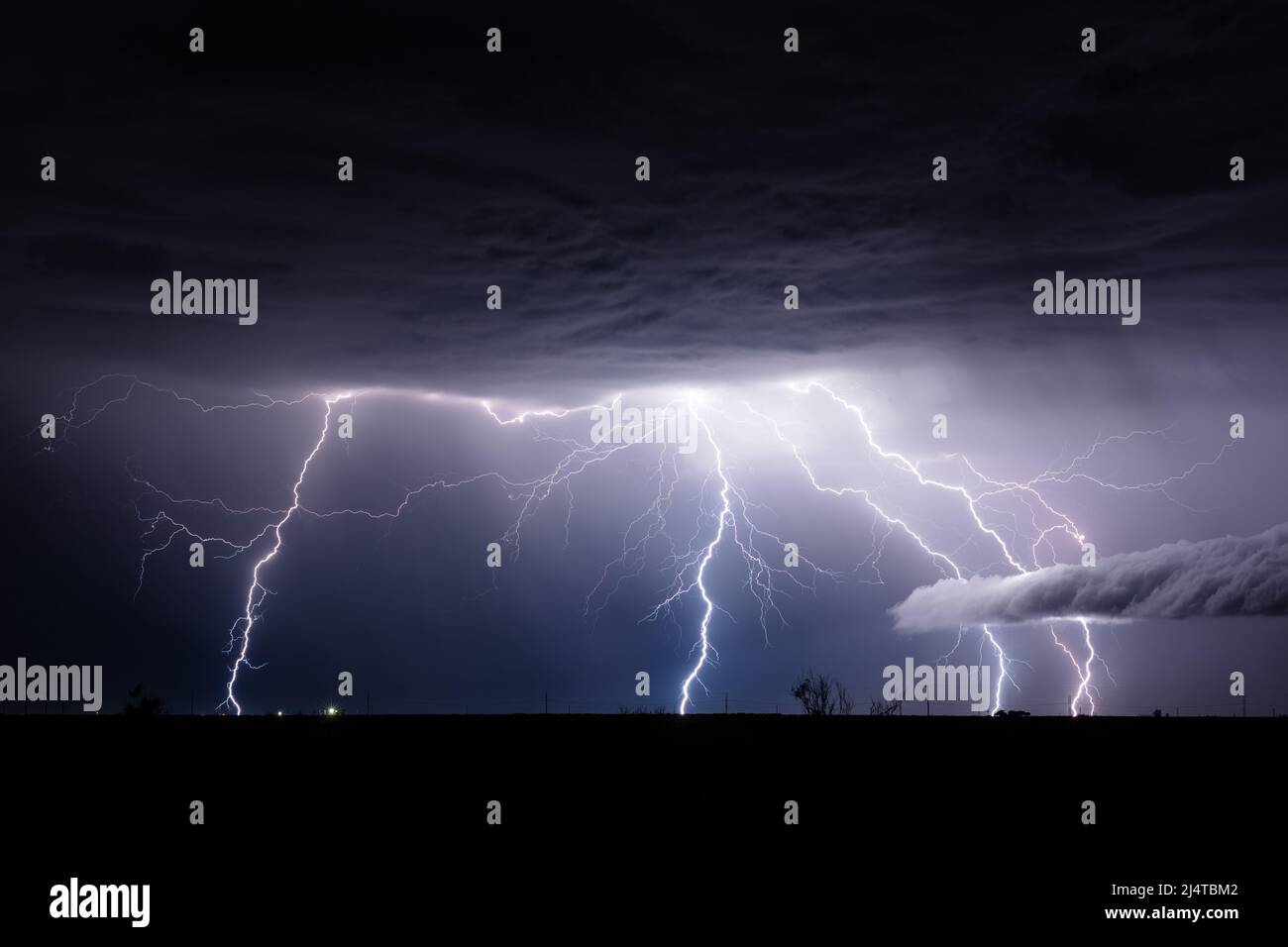 A powerful thunderstorm with intense lightning bolt strikes over Hobbs ...