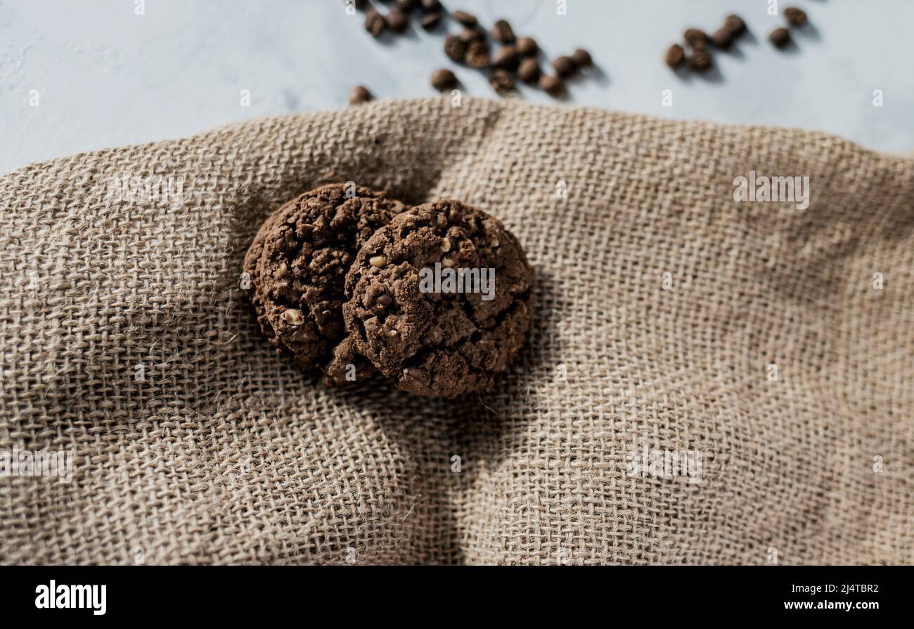 crispy chocolate cookies for breakfast on the background of burlap ...