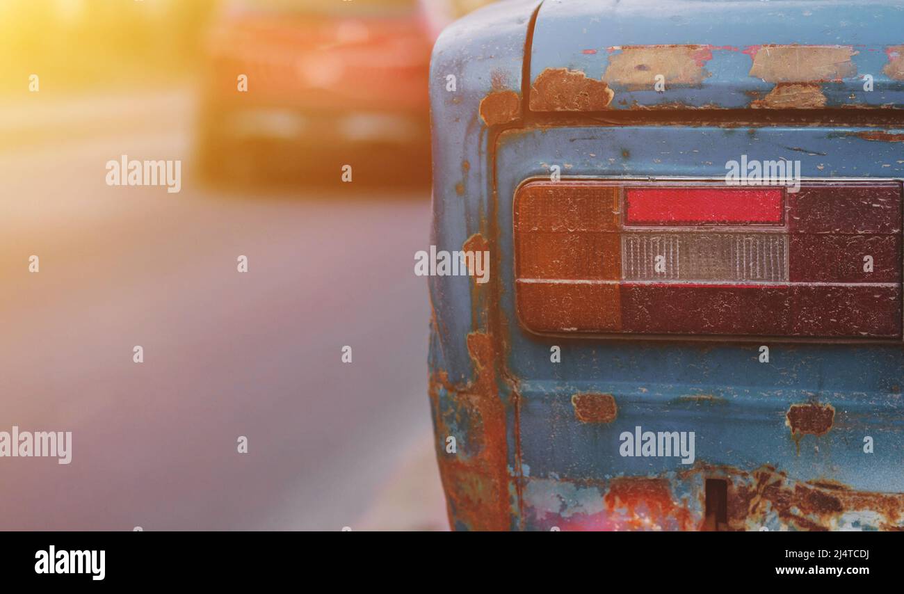 Forgotten rusty car on road. Abandoned rusty old car automobile. tail ...