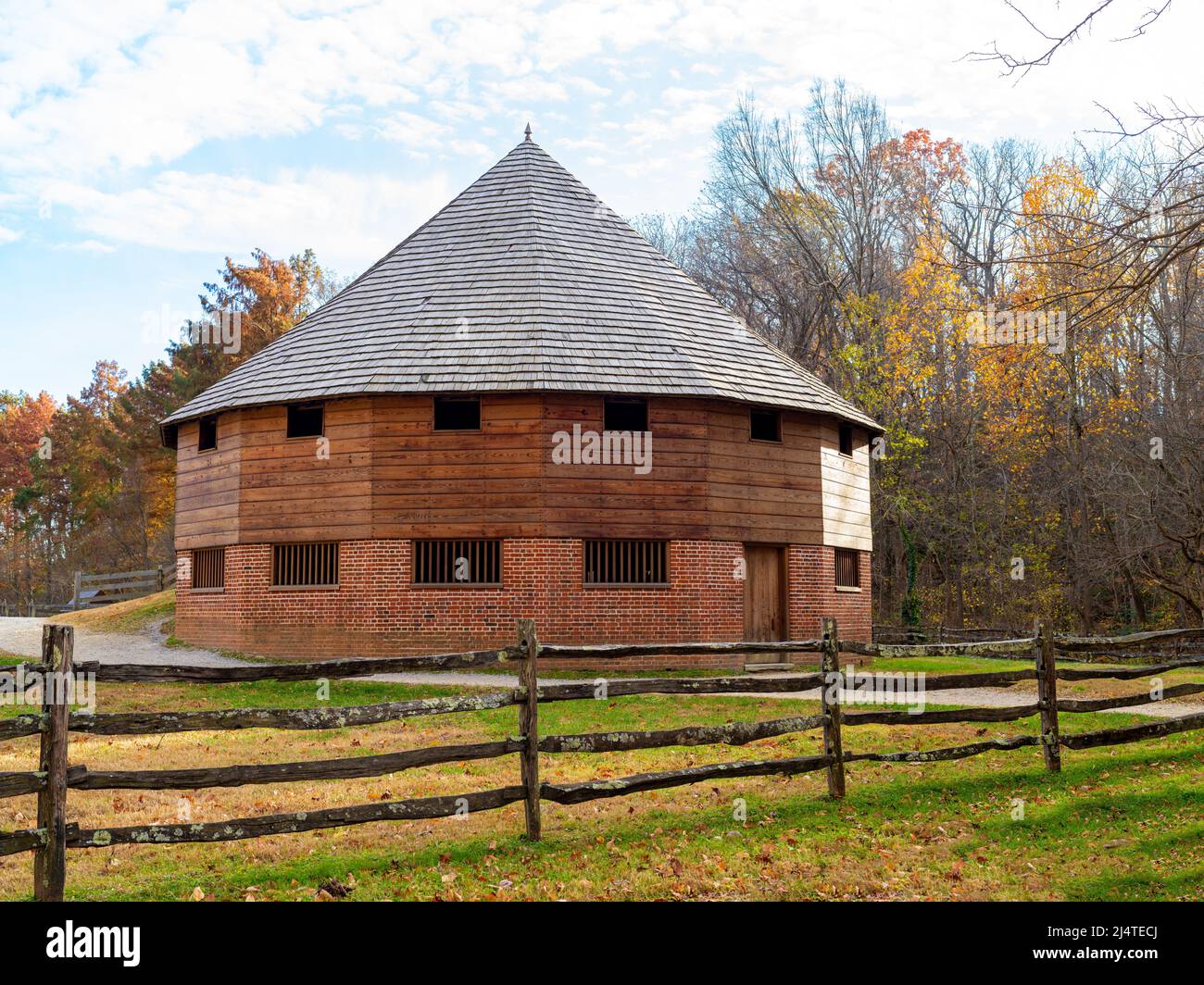 Deep in a Virginia forest a round barn stands amongst the trees Stock ...