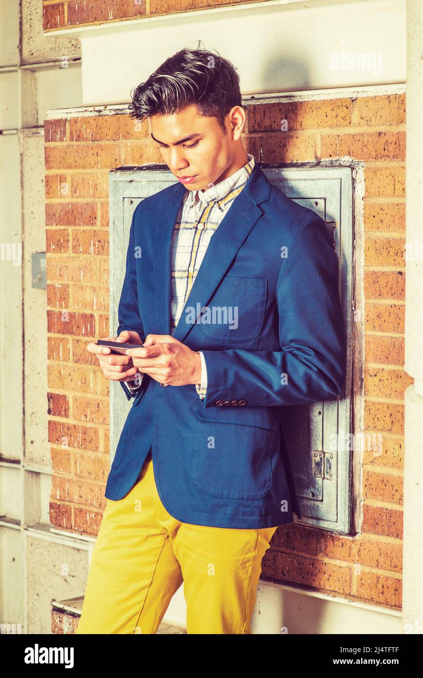 Man Texting Outside. Dressing in blue blazer, yellow pants, nice ...