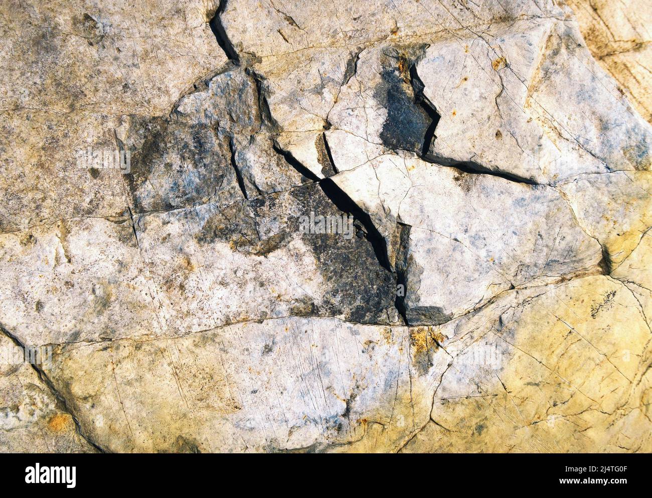 Abstract background or texture detail of a stone with cracks Stock ...