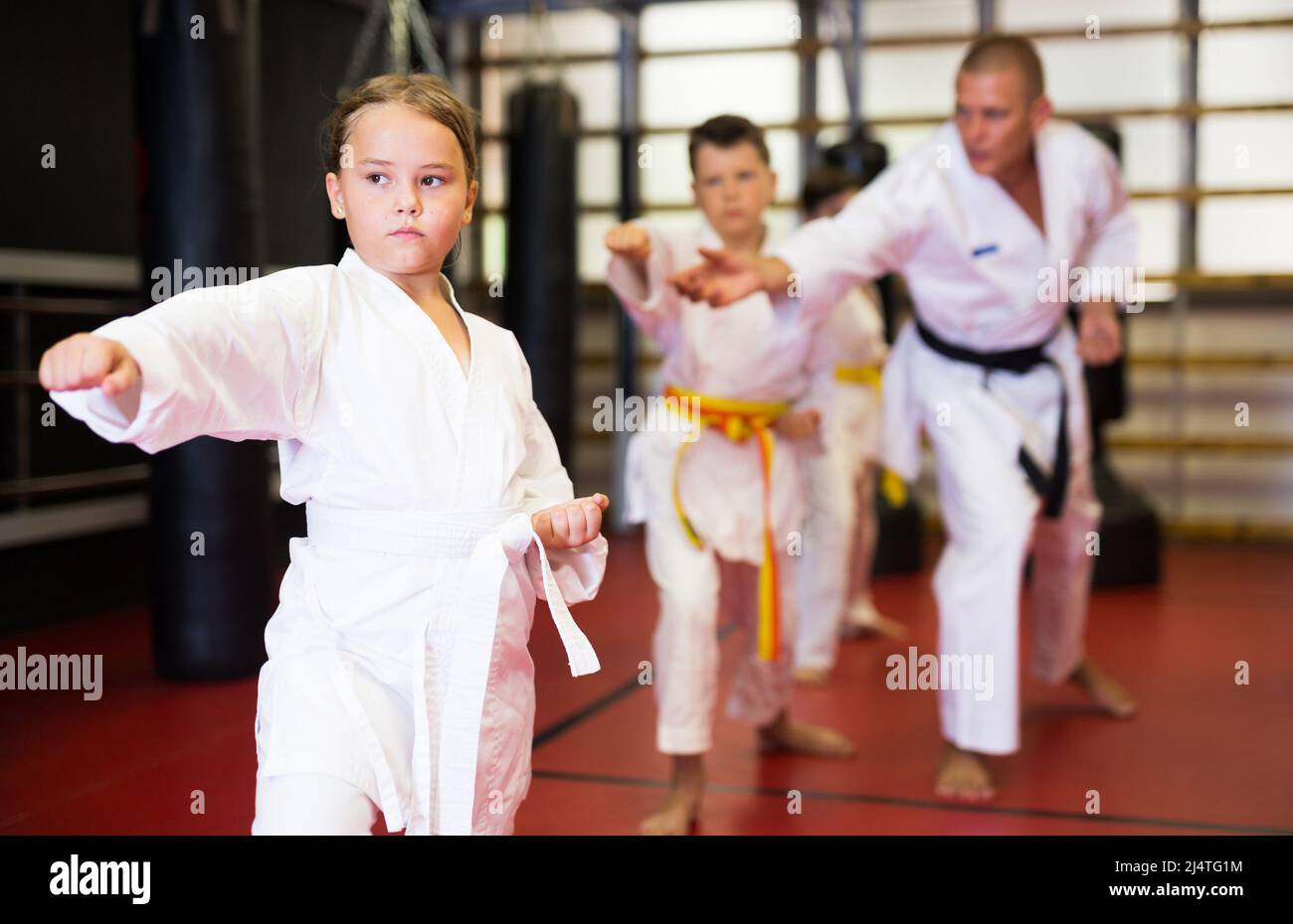Karate kids in kimono performing kata moves Stock Photo - Alamy