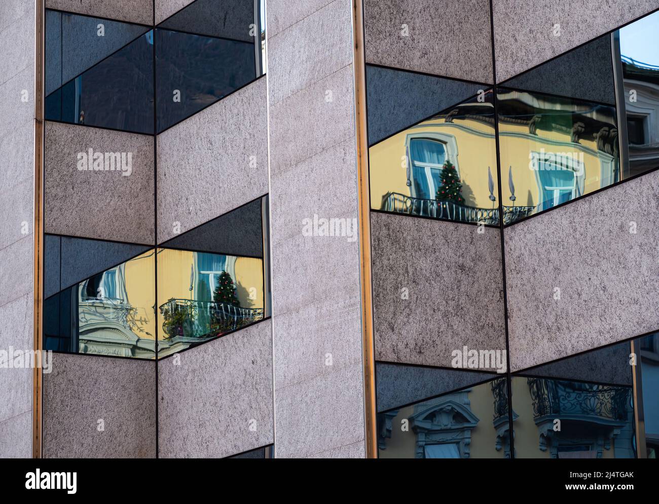 The architecture of a modern building, in which the windows reflect the ...