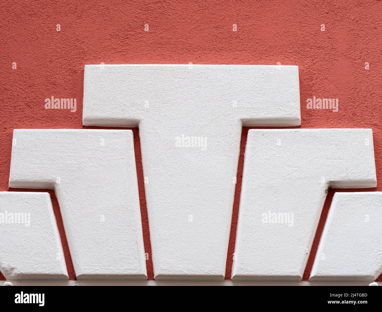 Detail of an abstract architectural pattern on the red facade of an old ...