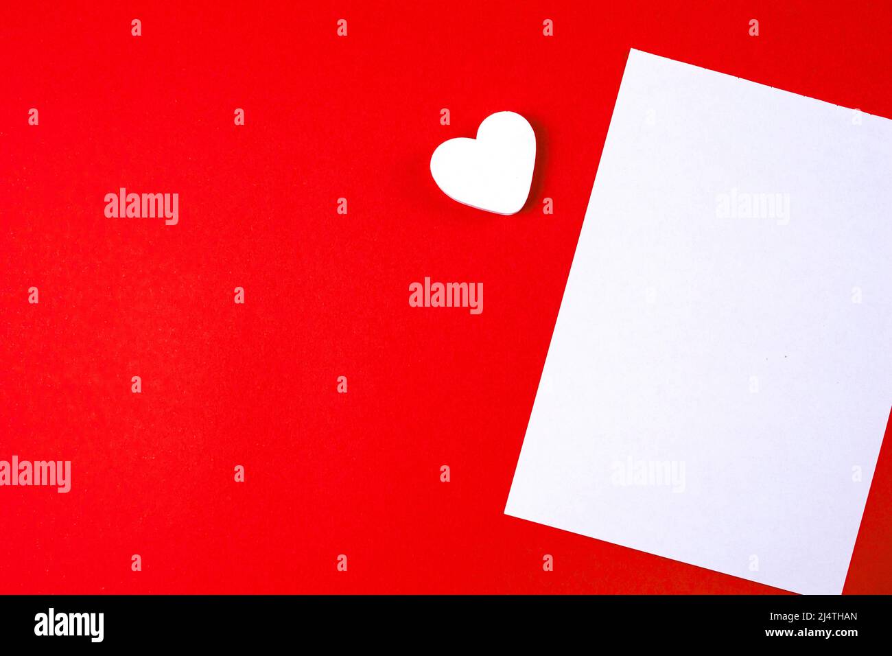 Love letter mock up template. Empty blank white paper on red paper ...