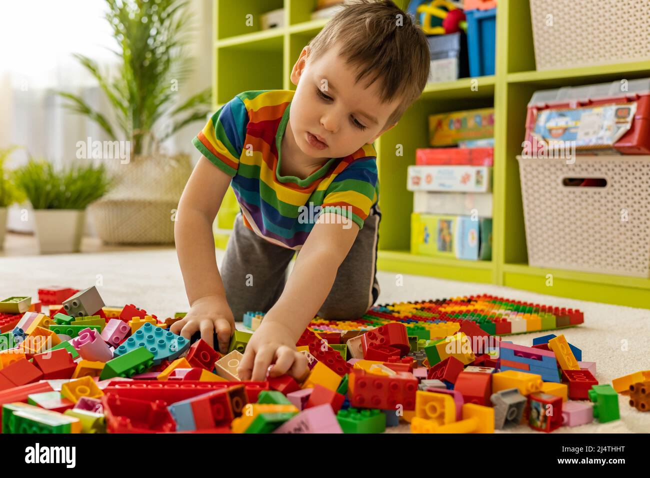 Khabarovsk, Russia, February 25, 2022. Top view cute baby boy playing ...