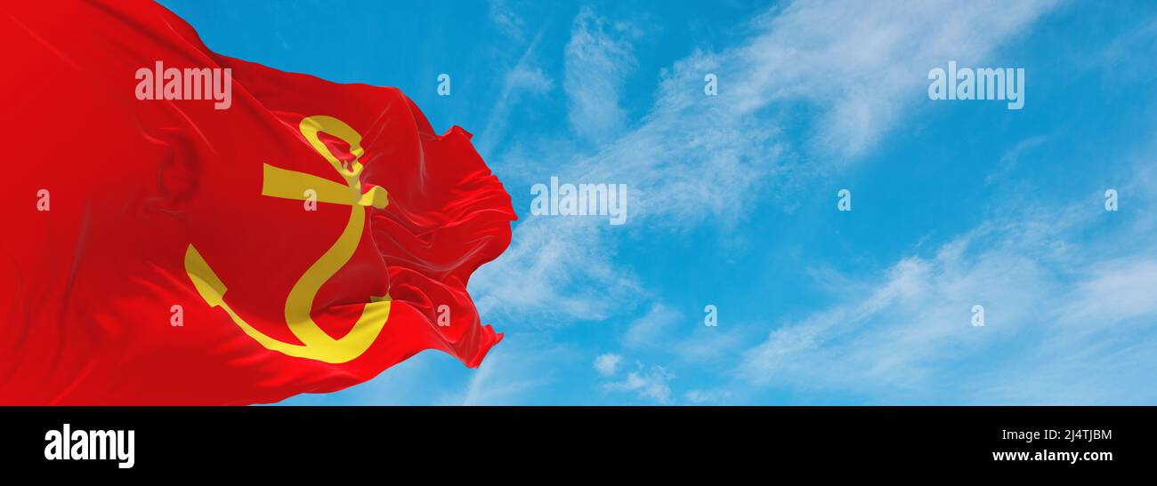 official flag of Narvik , Norway at cloudy sky background on sunset ...