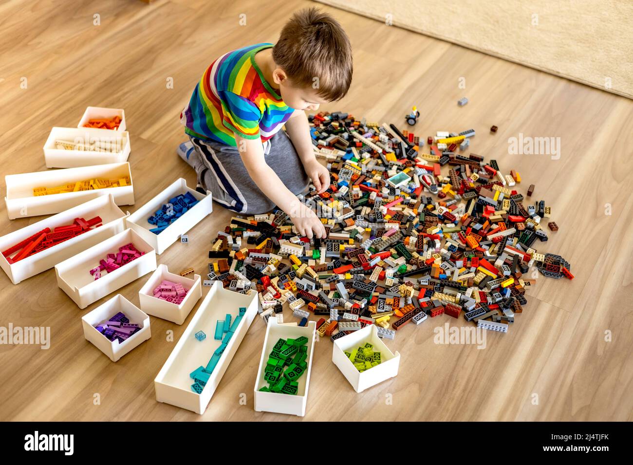 Khabarovsk, Russia, February 25, 2022. Cute baby boy sorting Lego ...
