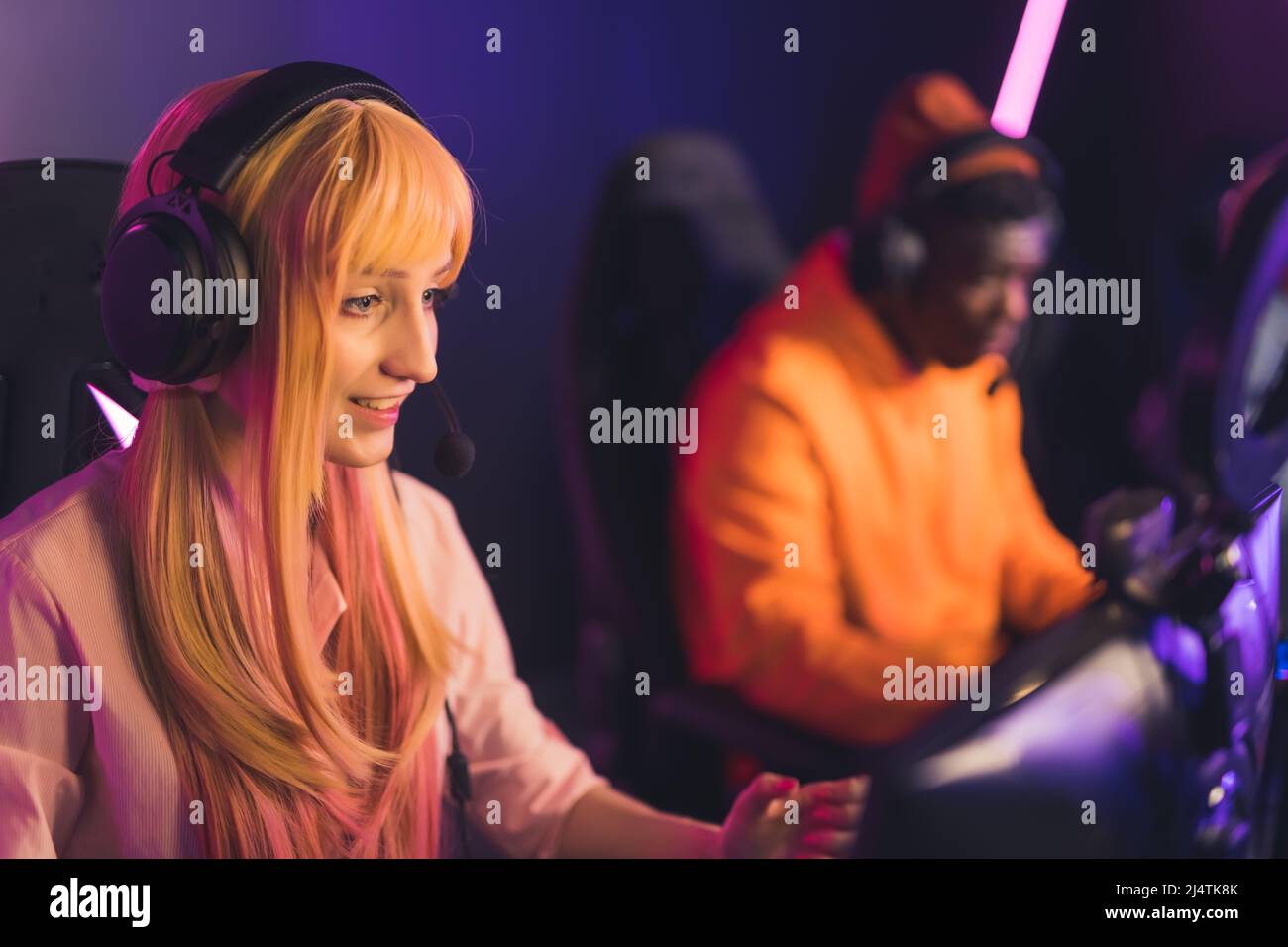 eSports team focusing on young attractive woman competing in an eSports ...