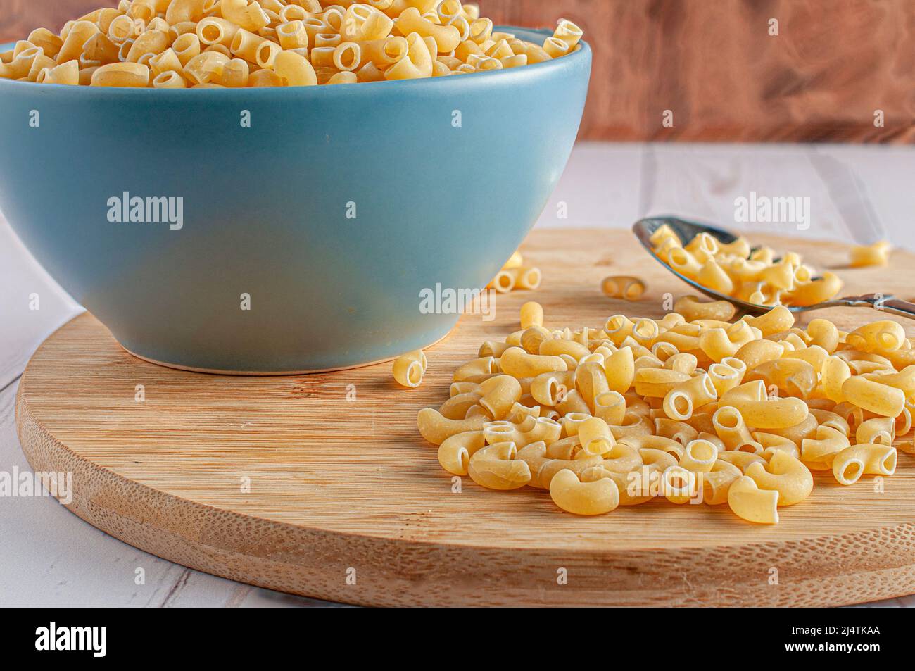 Wooden bowl uncooked elbow hi-res stock photography and images - Alamy