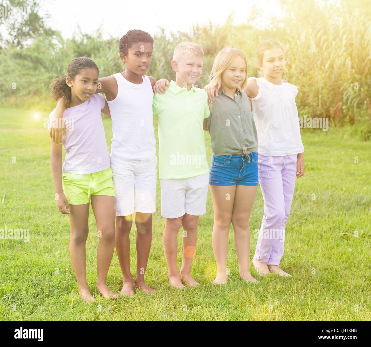 Group photo of kids on grass Stock Photo - Alamy