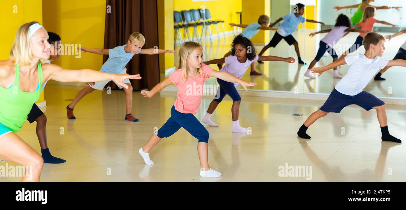 Active young children posing at dance class Stock Photo - Alamy