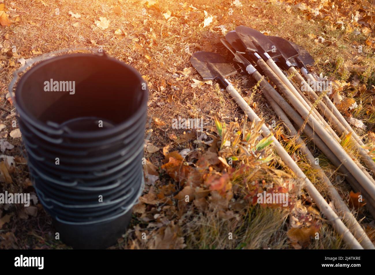 closeup of plastic bucket and shovel on ground or gardening tools for ...