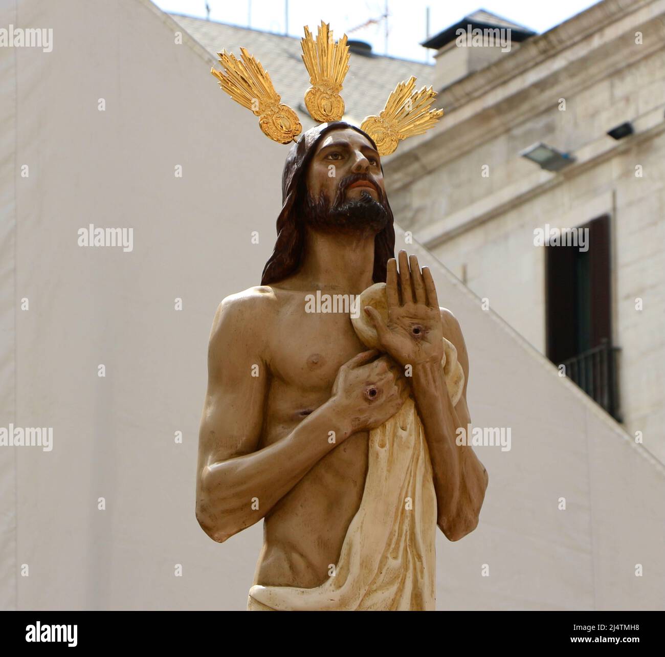 Carved wooden figure of Jesus Christ on a wheeled float in the Plaza ...