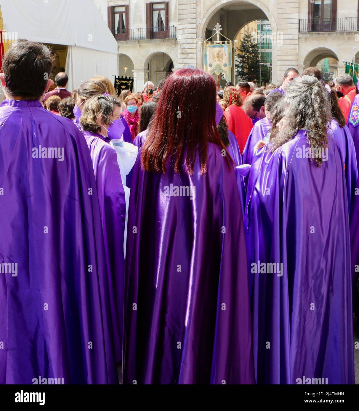 People dressed in traditional cloaks after the Easter Sunday procession ...