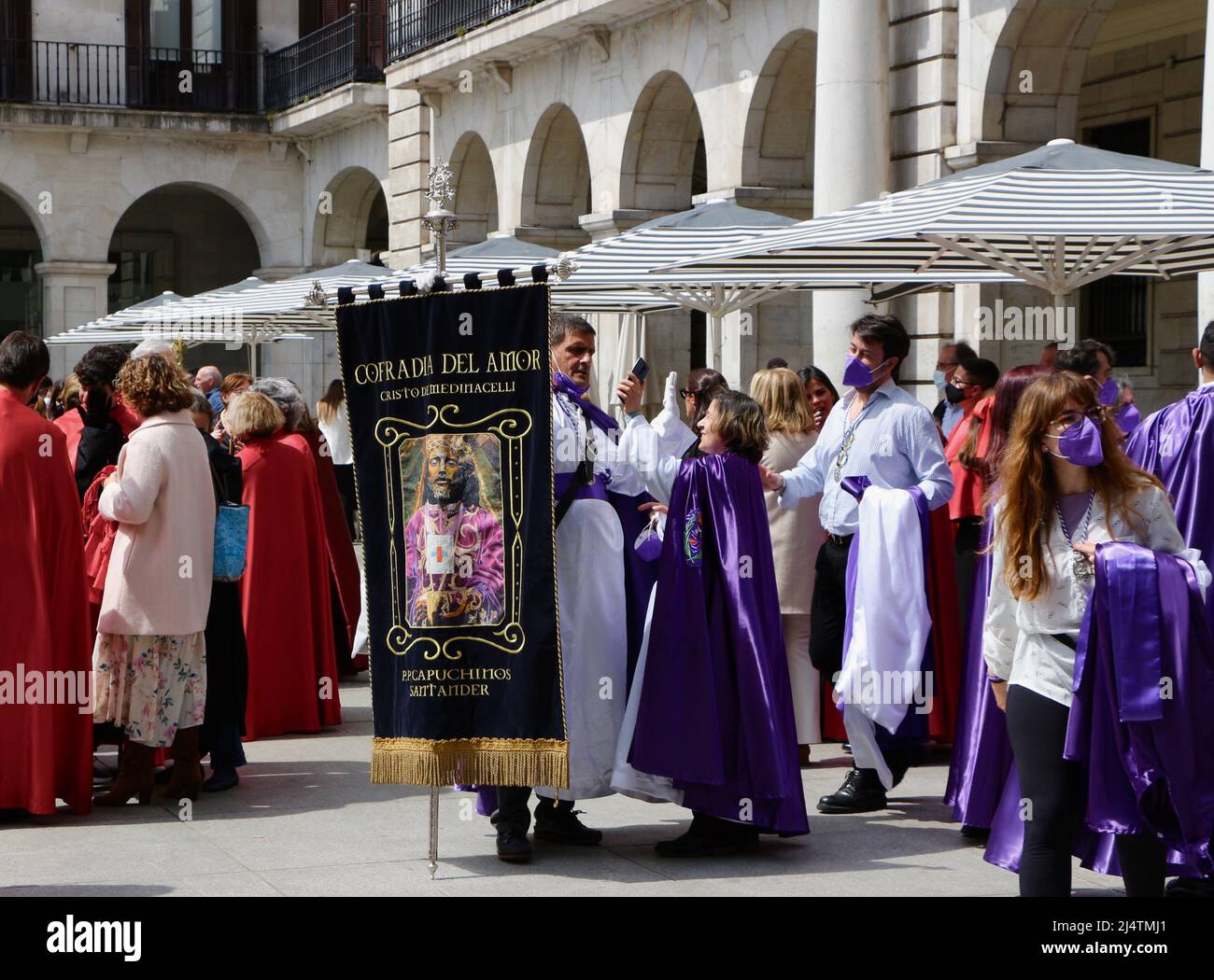 People dressed in traditional cloaks after the Easter Sunday procession ...