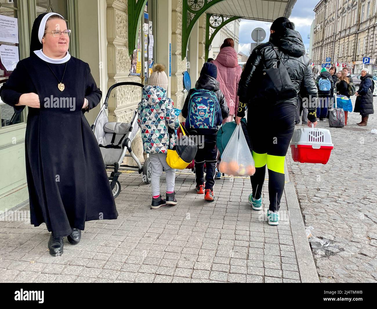 Przemysl, Poland. 17th Apr, 2022. Nun on Easter standing amongst ...