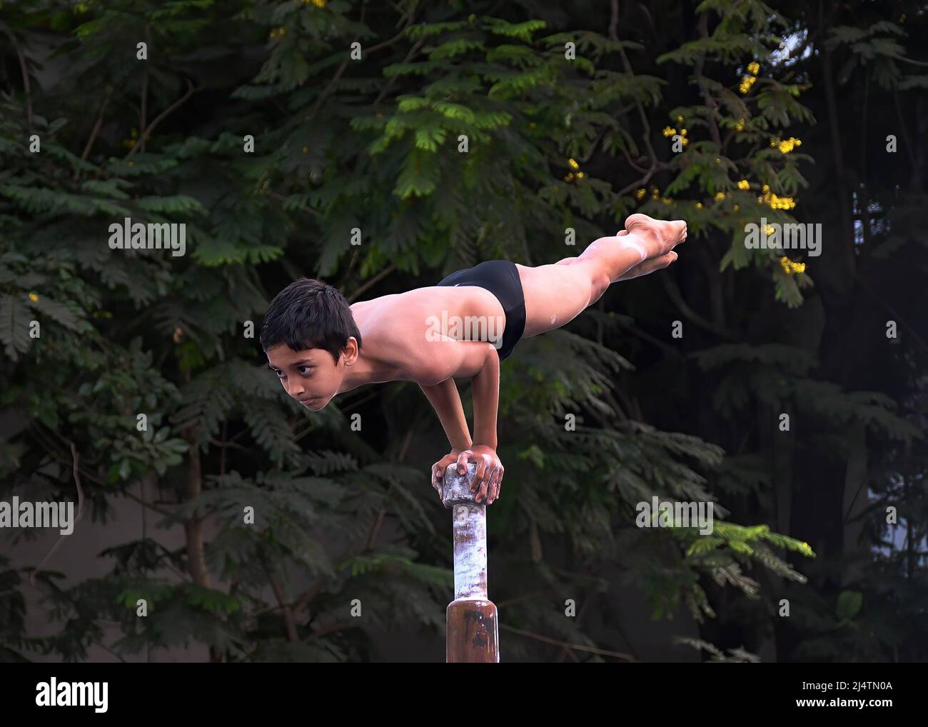 A boy performs during a Mallakhamb championship in Mumbai. Mallakhamb ...
