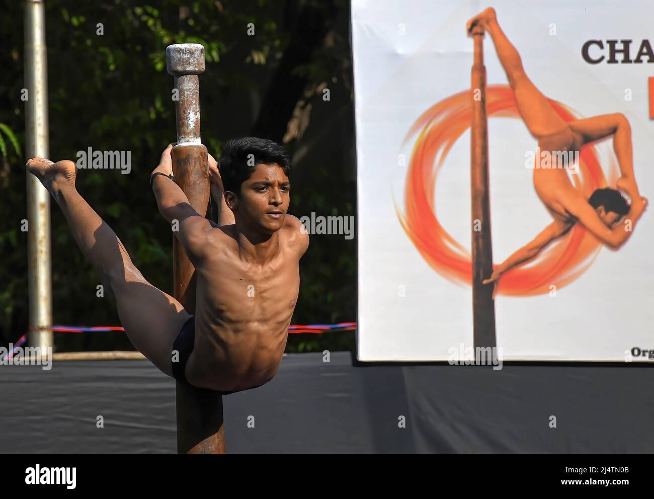 A boy performs during a Mallakhamb championship in Mumbai. Mallakhamb ...